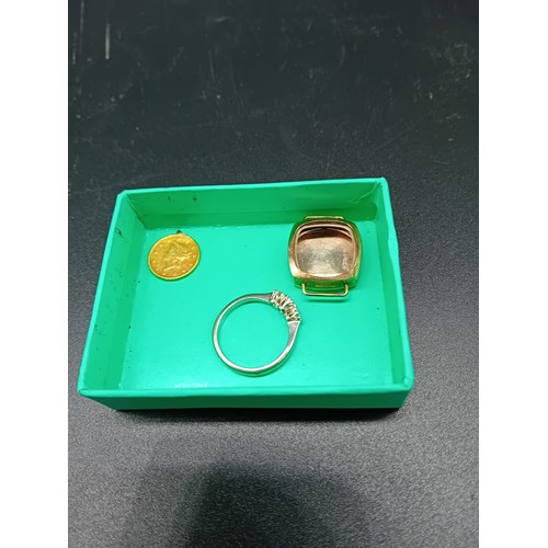 An 18 carat Gold 3 stone ring, a 9 carat Gold scrap watch case and a ...