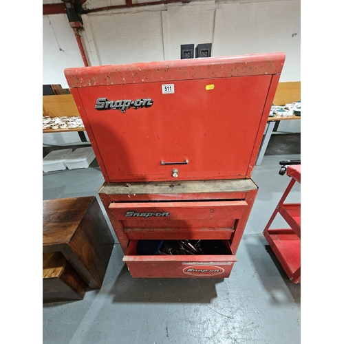 A snap on top box and rolling tool cab with spanners, hammers and other ...