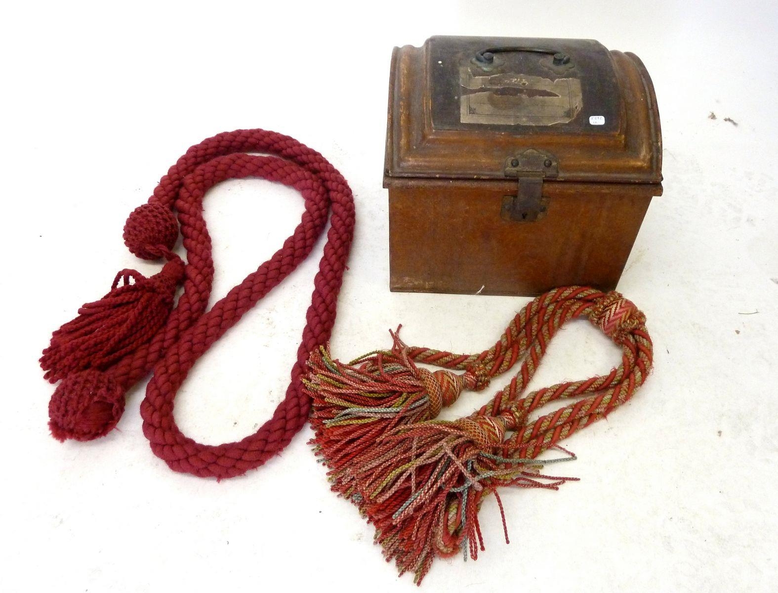 An old dome top tin box and two woven bell pull ropes, 30cm wide