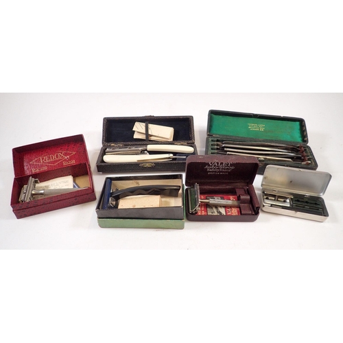 A collection of cut throat razors and safety razors, boxed, including ...