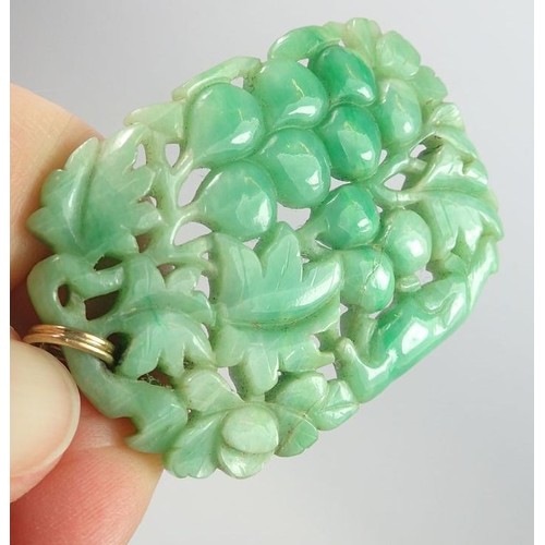 A fine Chinese jade bead necklace with vine carved decorative panel ...