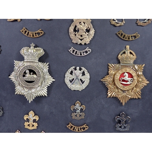 A large collection of military insignia to the Kings Liverpool Regiment ...