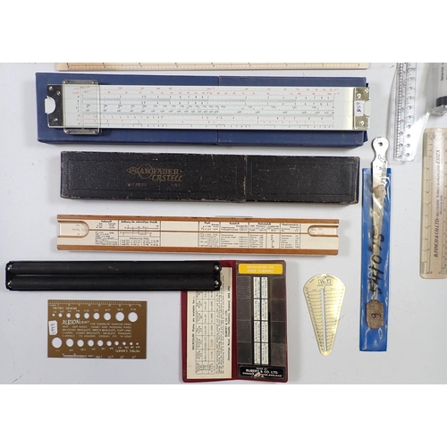 A collection of slide rules, rulers and gauges
