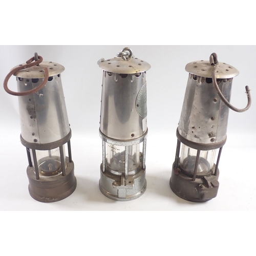 Three various The Protector Lamp & Lighting Co Ltd Eccles miners lamps ...