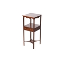 An Edwardian mahogany pot stand of square form. Having a lower tier ...