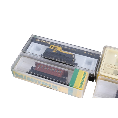An assortment of N gauge locomotives, wagons and accessories ...
