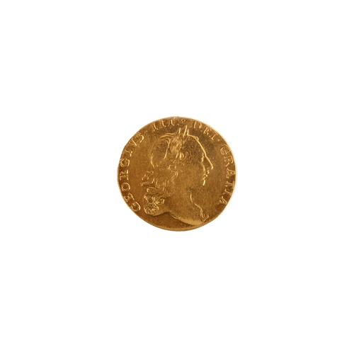 A 1764 George III gold Guinea coin. Weight 8.4g, diameter 25mm