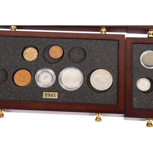 A modern wooden coin cabinet with coins. Consisting of 1939 to 1945 ...