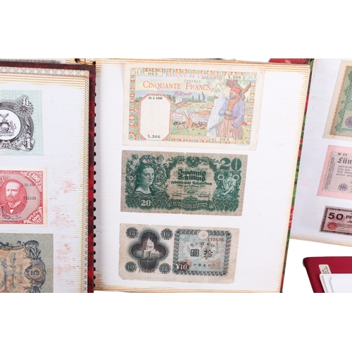 A large collection of assorted 20th century world banknotes in three ...