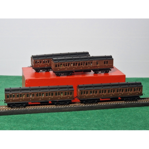 FOUR MODEL TRAIN PASSENGER CARRIAGES