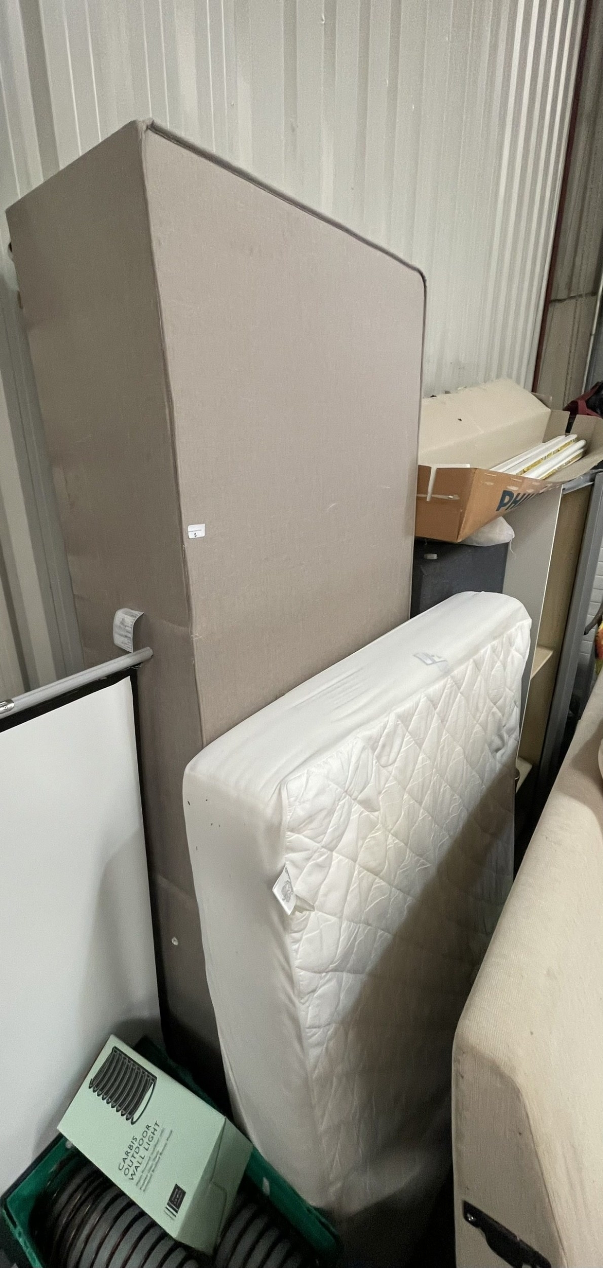 A DIVAN BED BASE ON CASTORS