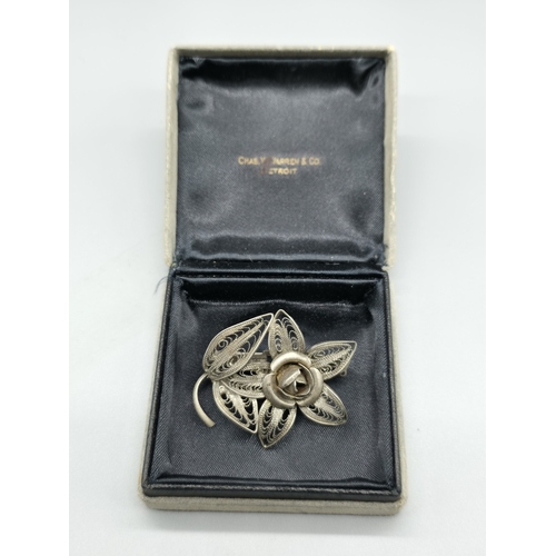 A FILIGREE FLOWER BROOCH, CHAS. WARREN & CO. OF DETROIT