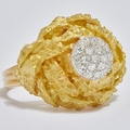 ABSTRACT DIAMOND RING, in 18 ct. gold. The top of abstract textured ...