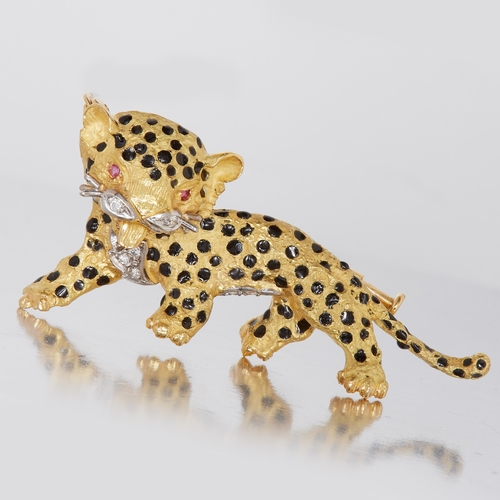 DIAMOND AND RUBY PANTHER BROOCH. set with diamonds with ruby eyes. with ...