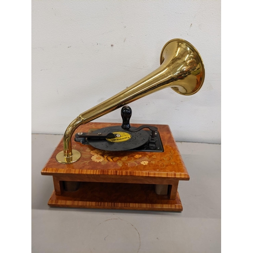 A vintage Thorens miniature gramophone with a selection of discs ...