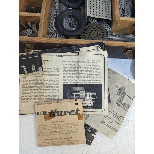 A box of Meccano, mainly in the bare metal, and a box of Trix ...