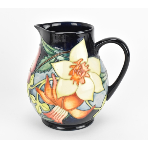 A Moorcroft pottery 'Queen's choice' pattern vase designed by Emma ...
