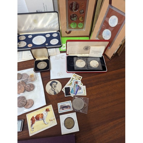 World Coins - A mixed lot comprising of Proof sets and mixed coins to ...