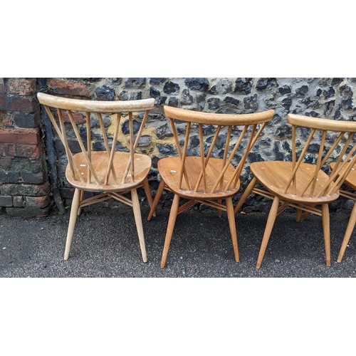 A set of four Ercol candlestick, elm and beech dining chairs, circa ...