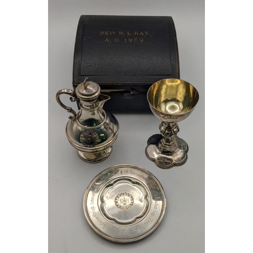 A Victorian gothic style silver communion set to include a chalice and ...