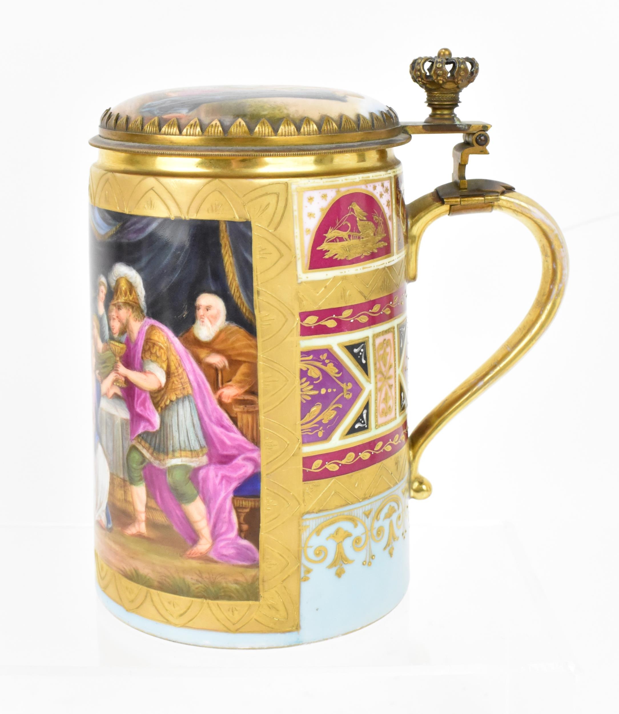 A brass-mounted Royal Vienna porcelain tankard, of cylindrical form ...