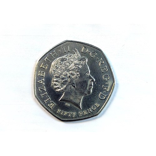 An album of 20, 50p and one £2 coin to include a replica/re-strike 2009 ...
