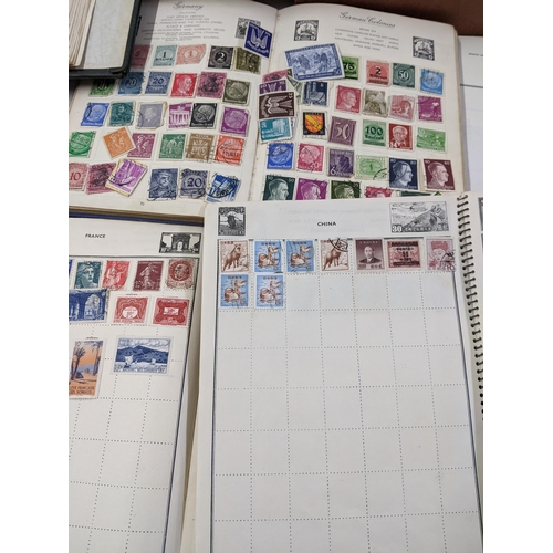 Various part filled albums of stamps from around the world as well as ...