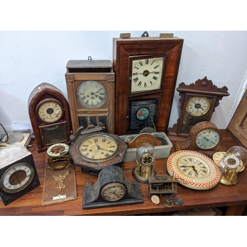 A selection of clocks and clock parts to include a F.W Elliott Post ...