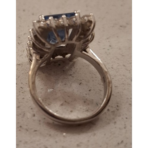 A Ciro large blue topaz ring surrounded by cubic zirconias set in a ...