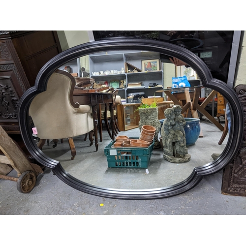 An Oka Direct Ltd. black framed contemporary wall mirror, 118 x 89cms ...