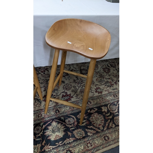 A pair of Devol ash and oak 'Bum' stools, in the Ercol design Location ...
