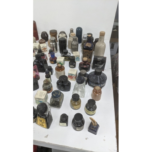 A collection of vintage ink pots and inkwells to include Parker ...