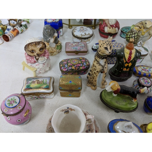 A large collection of trinket boxes, some Beatrix Potter figures and a ...