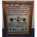 A mid 20th Century Welsh wool cross stitch sampler with religious verse ...
