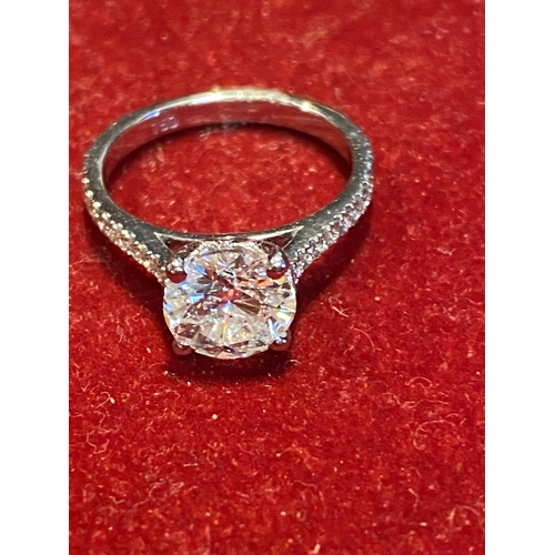 18 ct White Gold Diamond Solitaire Ring with diamond shoulders. Centre ...