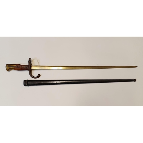 A late 19th century French bayonet, dated 1876, and a scabbard, 66 cm