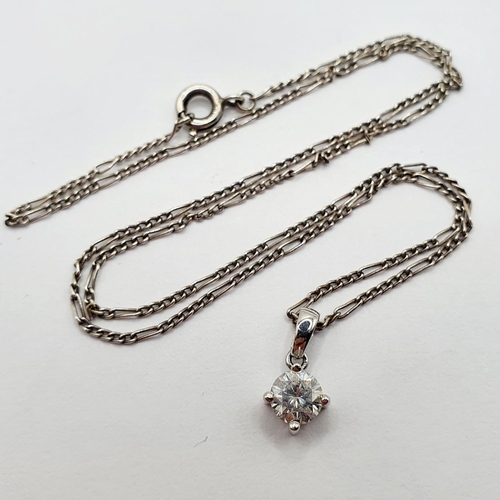 An 18ct white gold and diamond single stone pendant, 70 points, on a chain