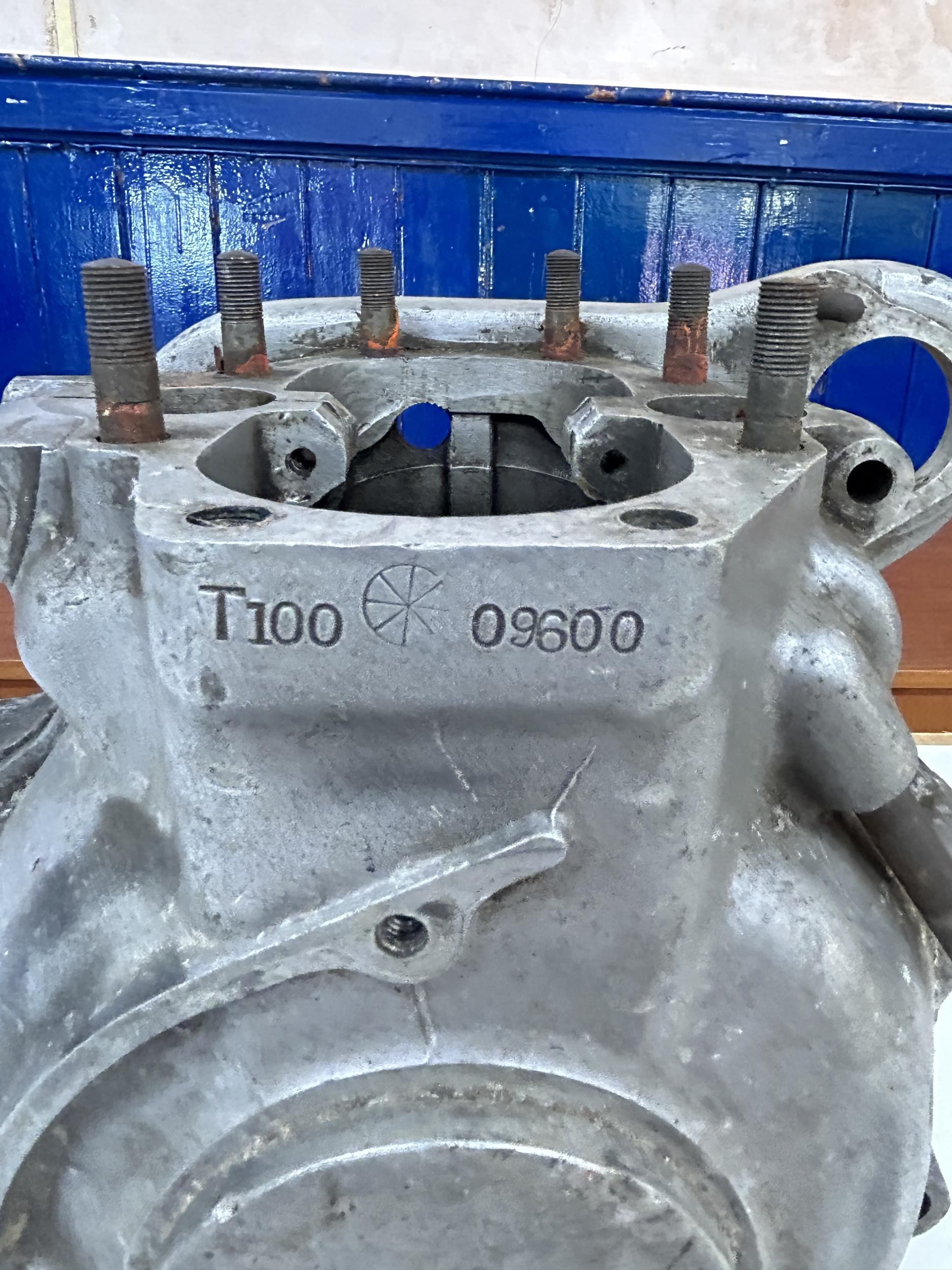 A Triumph T100 motorcycle engine casing, stamped T100 09600