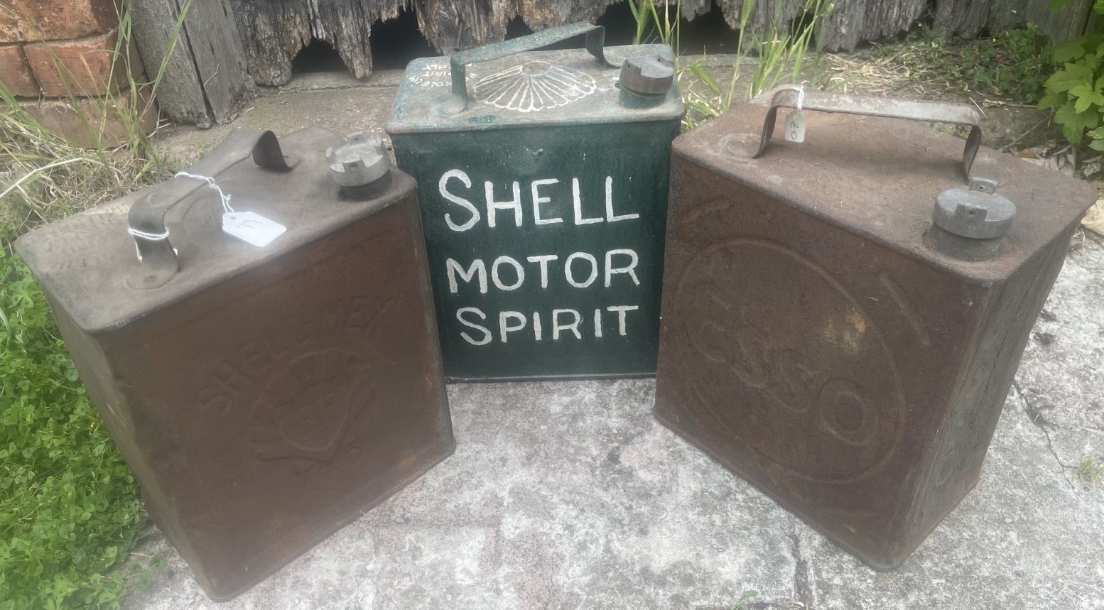 Three vintage fuel cansPainted Shell fuel can, another Shell fuel can ...