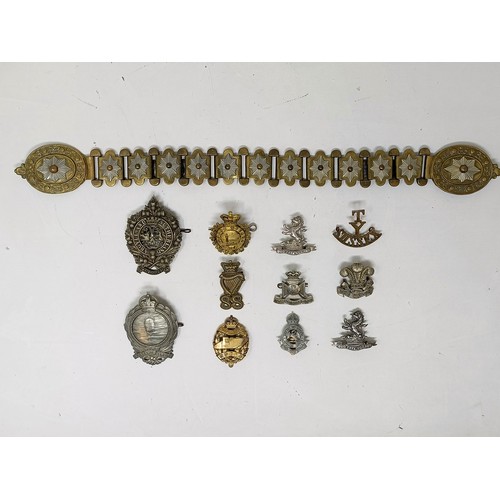 A group of military badges, including Mine Clearance Service