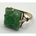 A 9ct gold and Chinese green stone ring, carved foliate forms