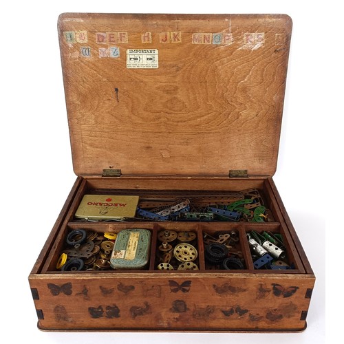 Assorted vintage Meccano, in a wooden box