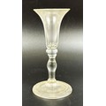 An 18th century cordial glass, with a knopped stem, on a folded foot ...
