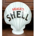 A Sealed Shell opaque glass clamshell pump globe, 42.5 cm high