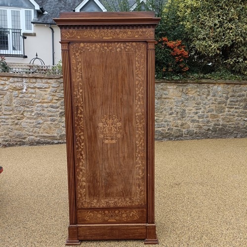 A 19th century Continental cupboard, of architectural form, marquetry ...