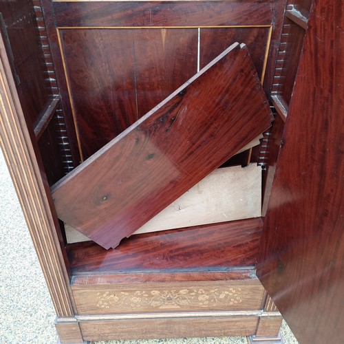 A 19th century Continental cupboard, of architectural form, marquetry ...
