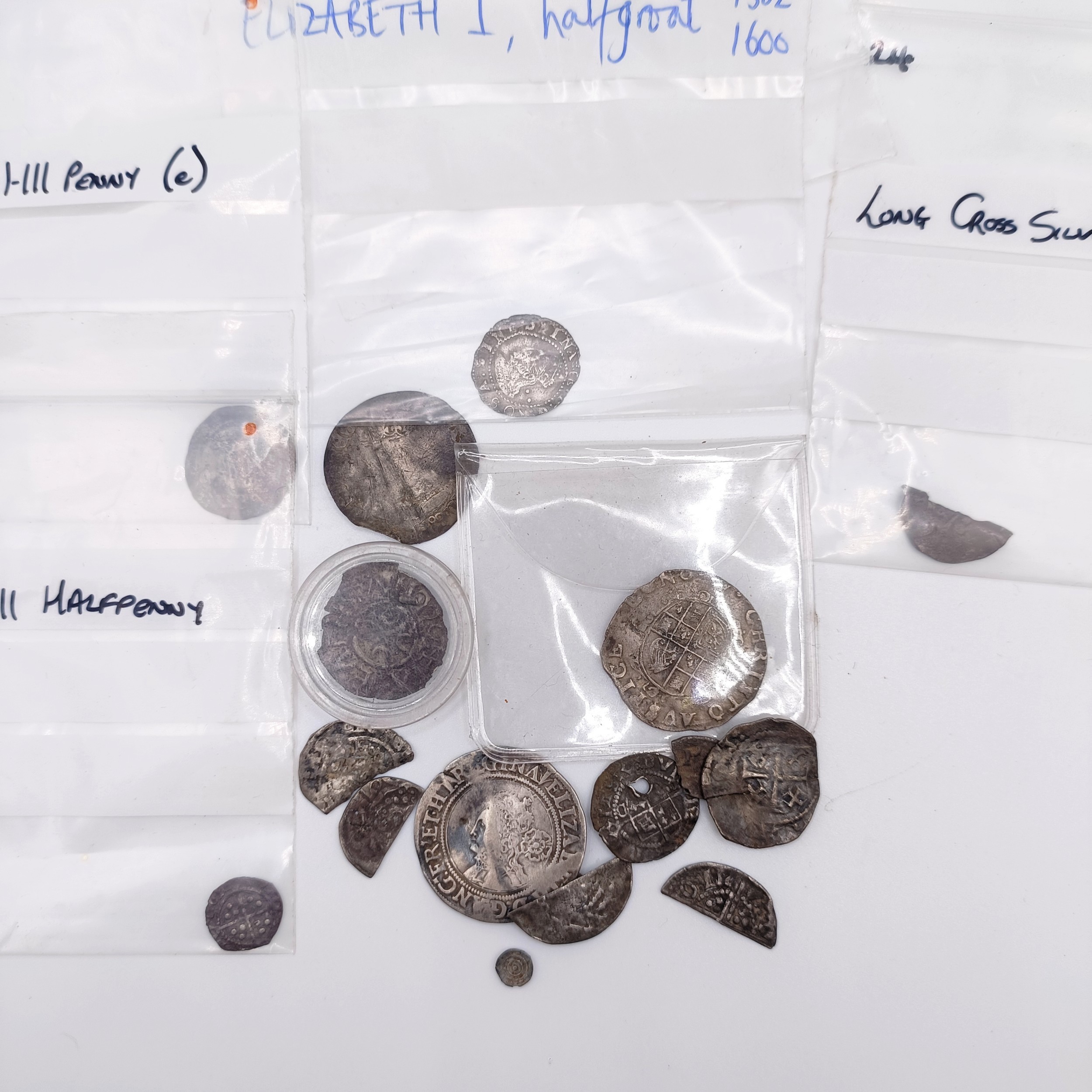 A group of hammered silver coins, including an Elizabeth I half groat ...