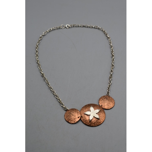 A 925. Silver and Hammered Copper Star Necklace.