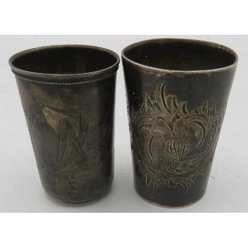 Two small Russian white metal tot measures, both with engraved ...