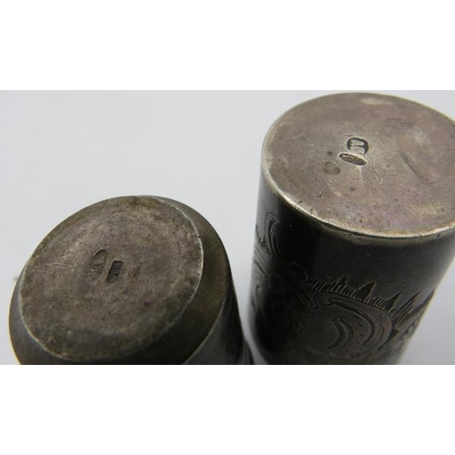 Two small Russian white metal tot measures, both with engraved ...